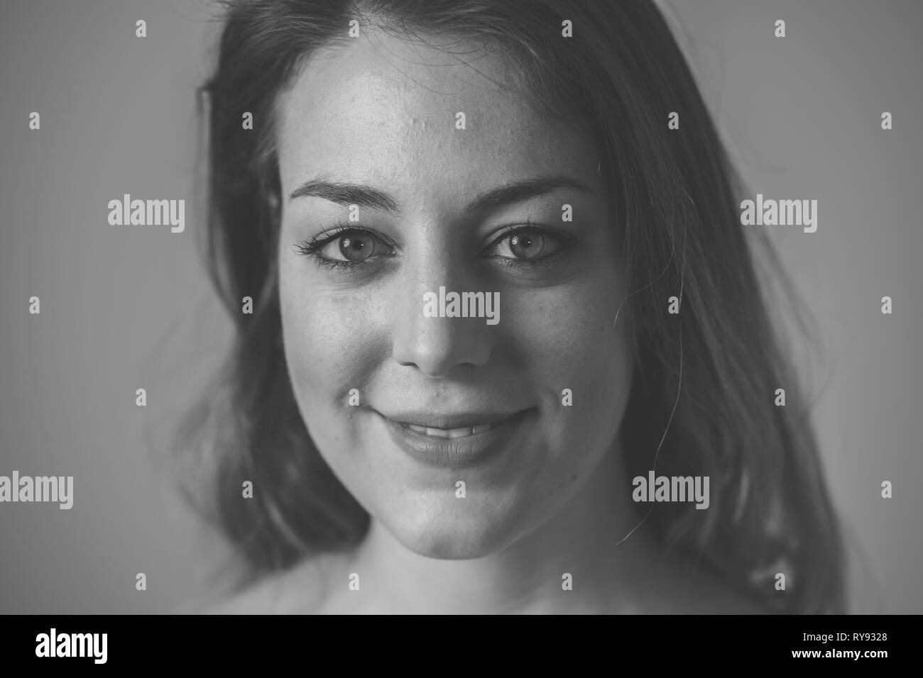 Close up portrait of attractive young caucasian woman with happy face ...