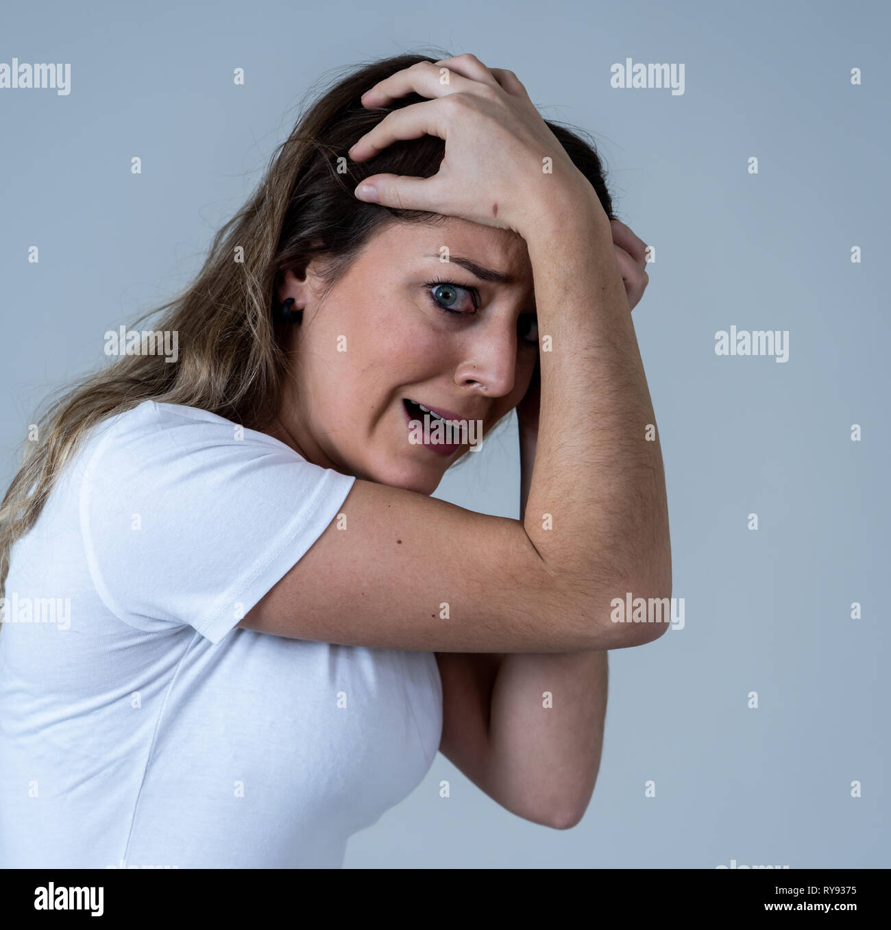 Close up of young woman feeling scared and shocked making fear, anxiety ...