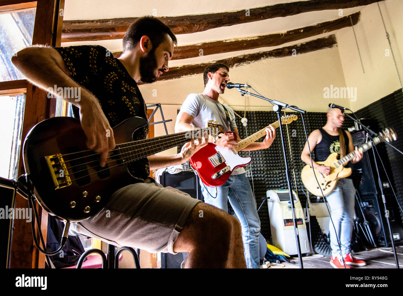Male musicians singing and playing guitars in studio Stock Photo - Alamy
