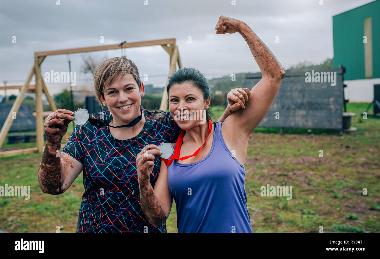 Athletes showing medals after race Stock Photo - Alamy