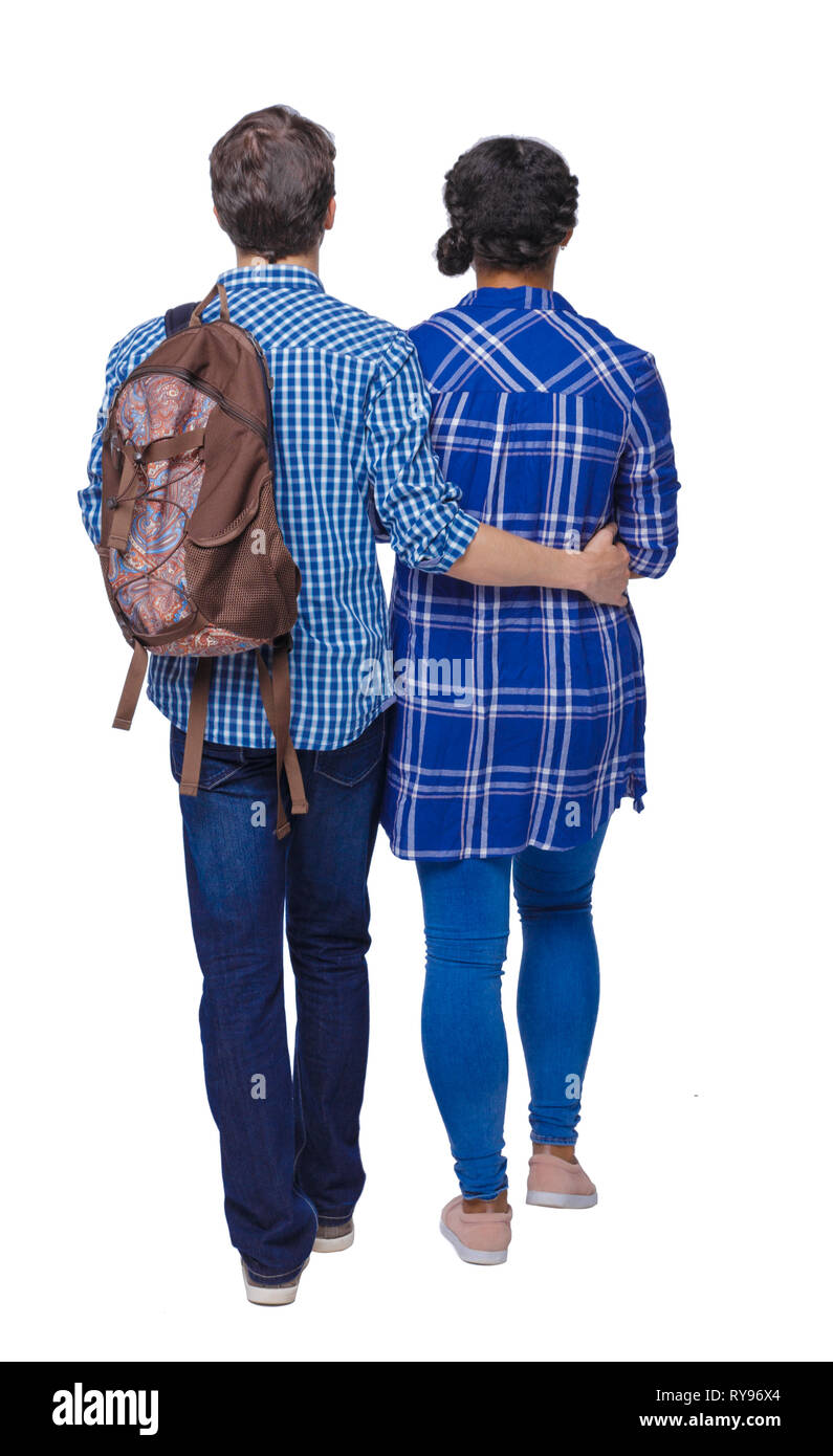 Back view of interracial going couple. walking friendly girl and guy ...