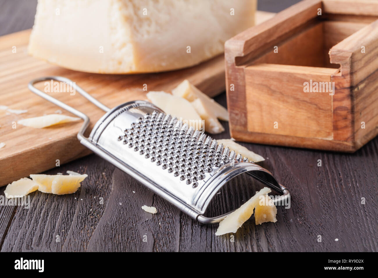 Traditional Italian hard cheese Parmesan and Grana Padano with grater ...