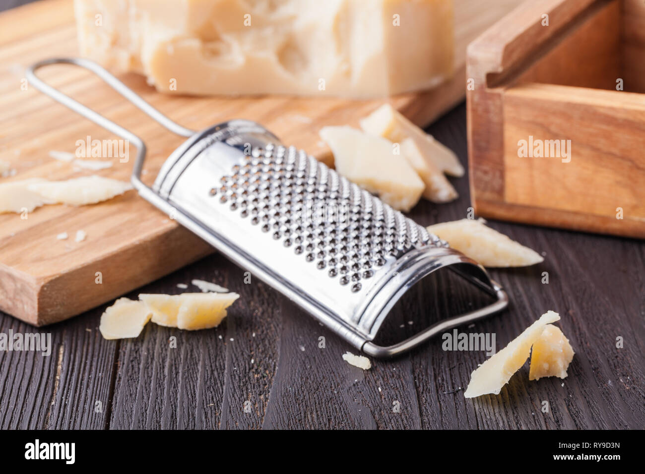 Parmesan cheese. Grated Parmesan cheese and Olive Wood Parmesan Cheese ...