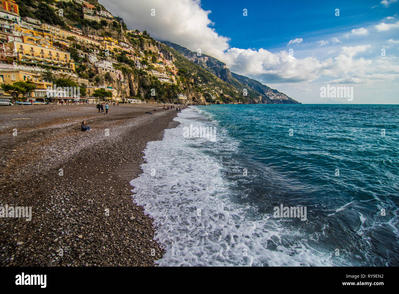 Panoramic view of the beach and colorful buildings of Positano, Italy ...