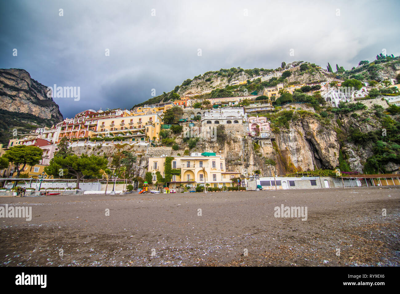 Positano beach with colorful buildings and cliffs hi-res stock ...
