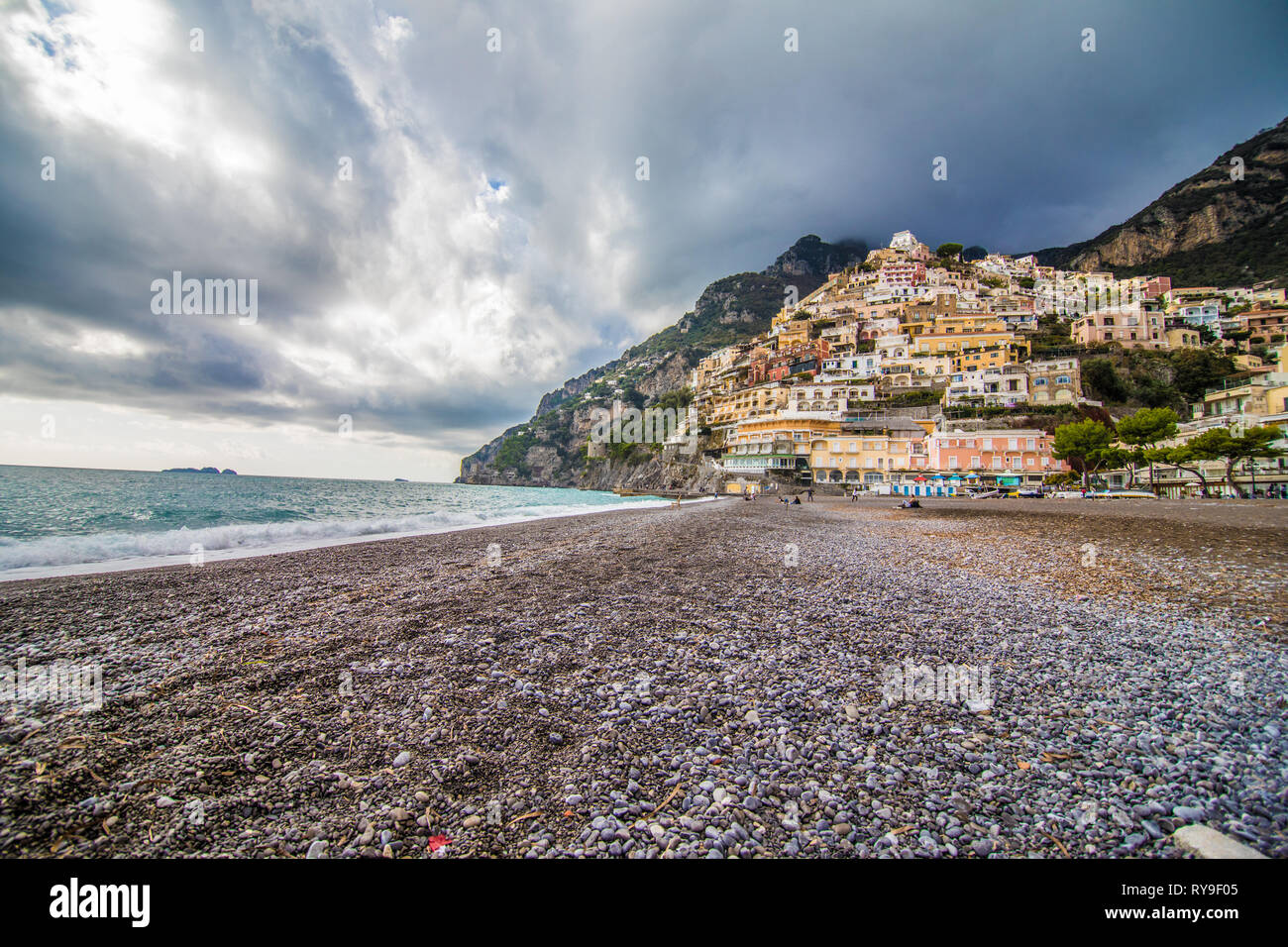 Panoramic view of the beach and colorful buildings of Positano, Italy ...