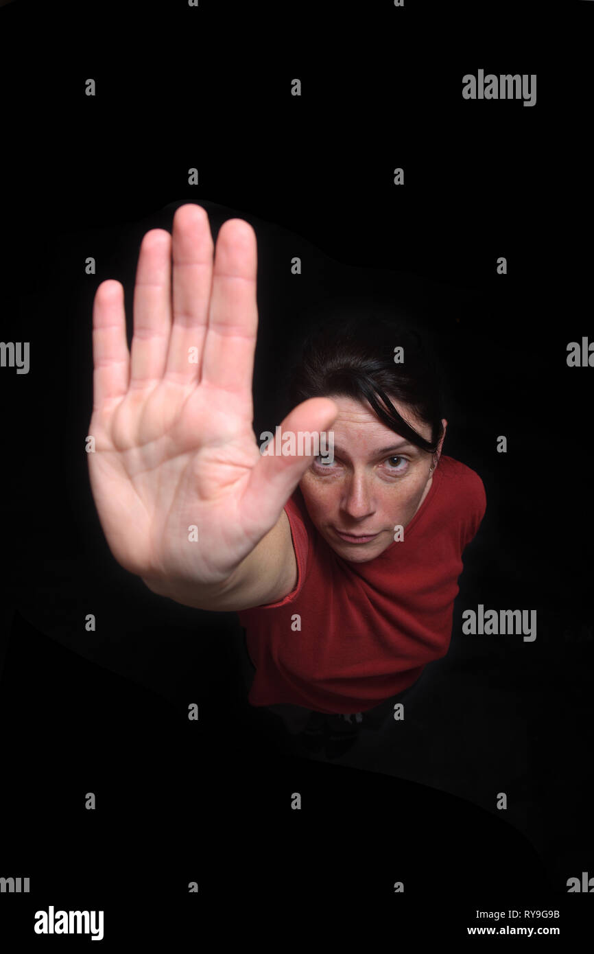 woman hand stop sign on black background Stock Photo - Alamy