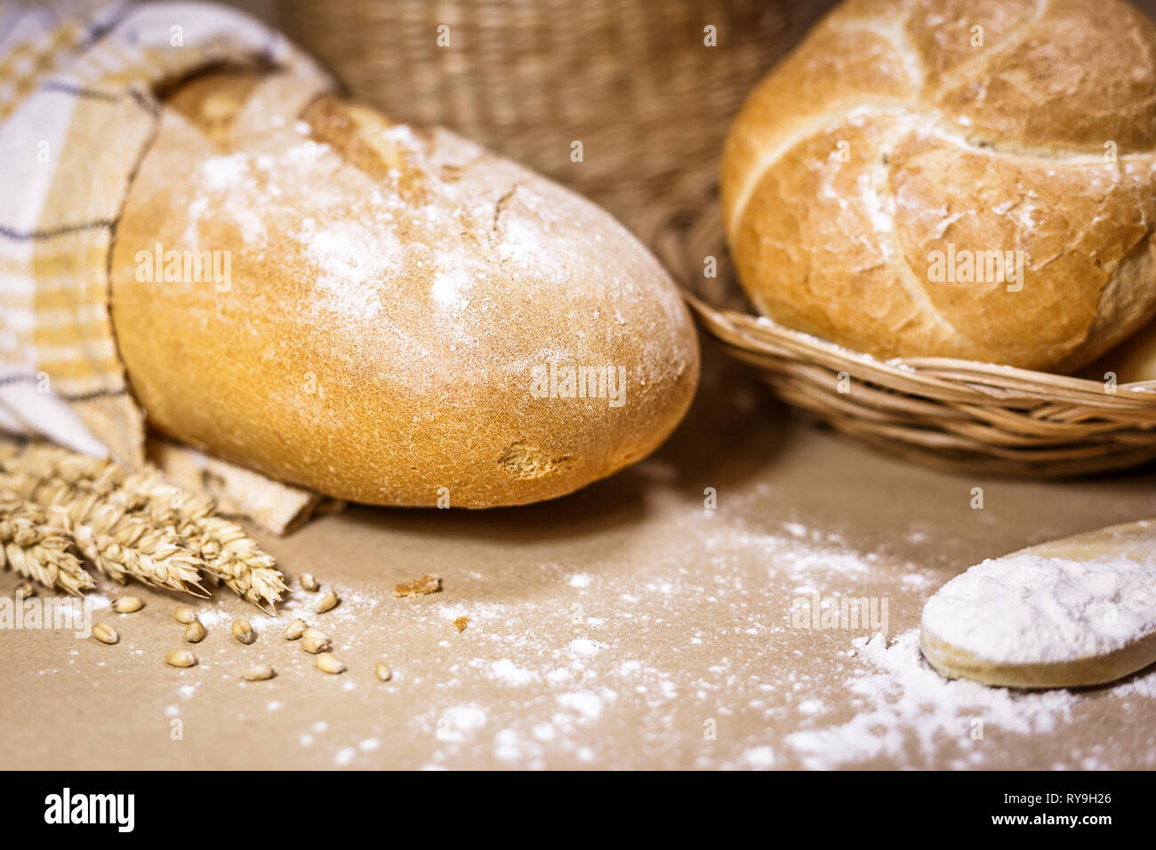 Close-up view of two different kind of freshly baked bread on a rustic ...