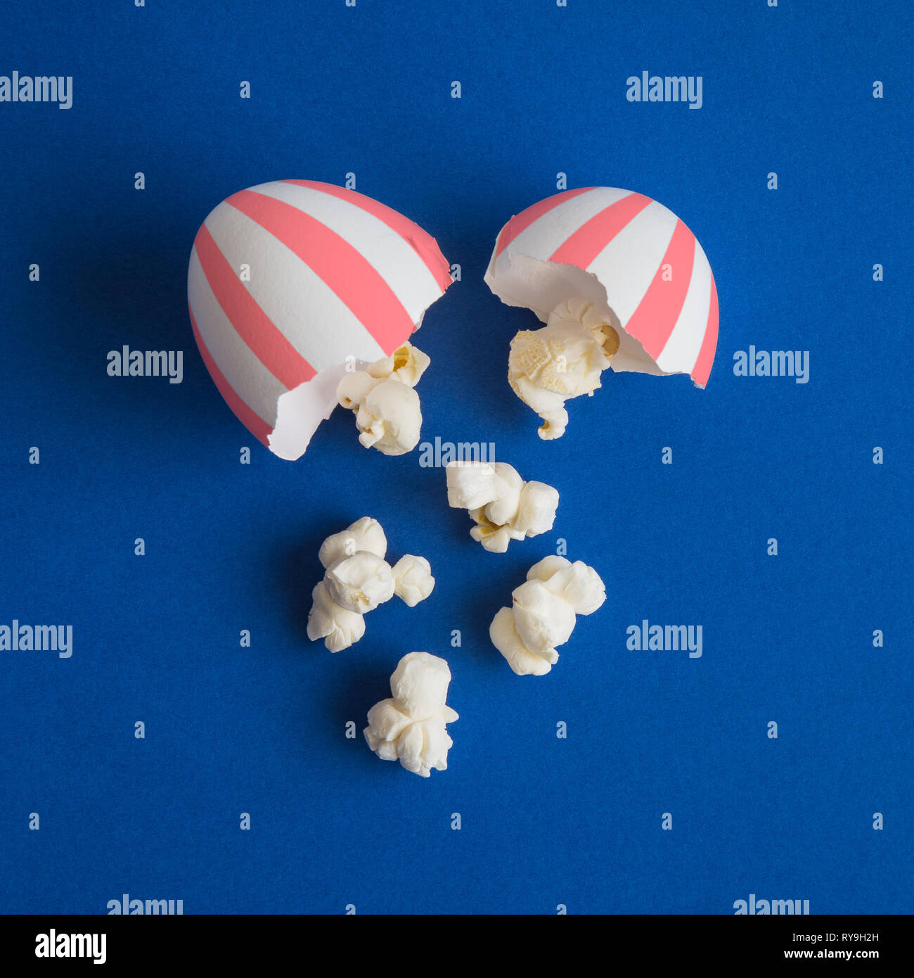 Popcorn out from broken egg minimal food and cinema creative concept ...