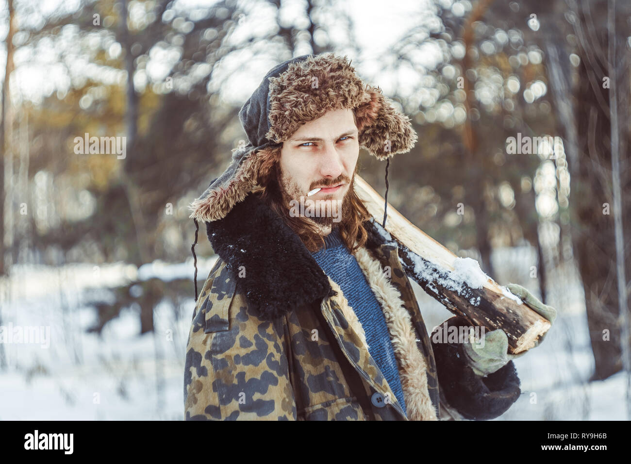 Siberian Russian man in a hat earflaps with a cigarette Stock Photo - Alamy