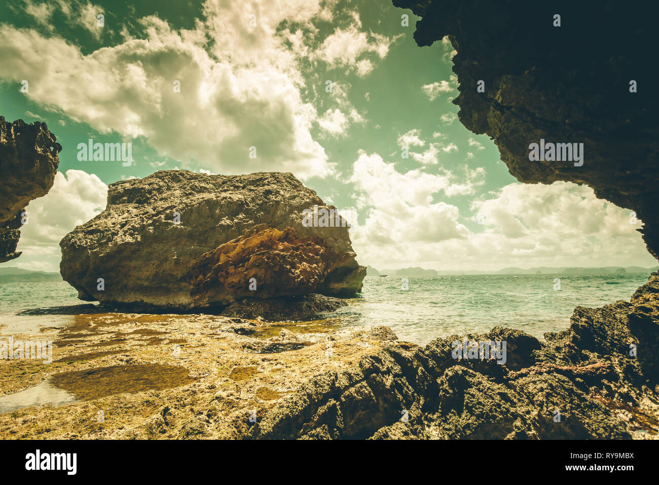 Pacific ocean beach with rocks. vintage toned picture Stock Photo - Alamy