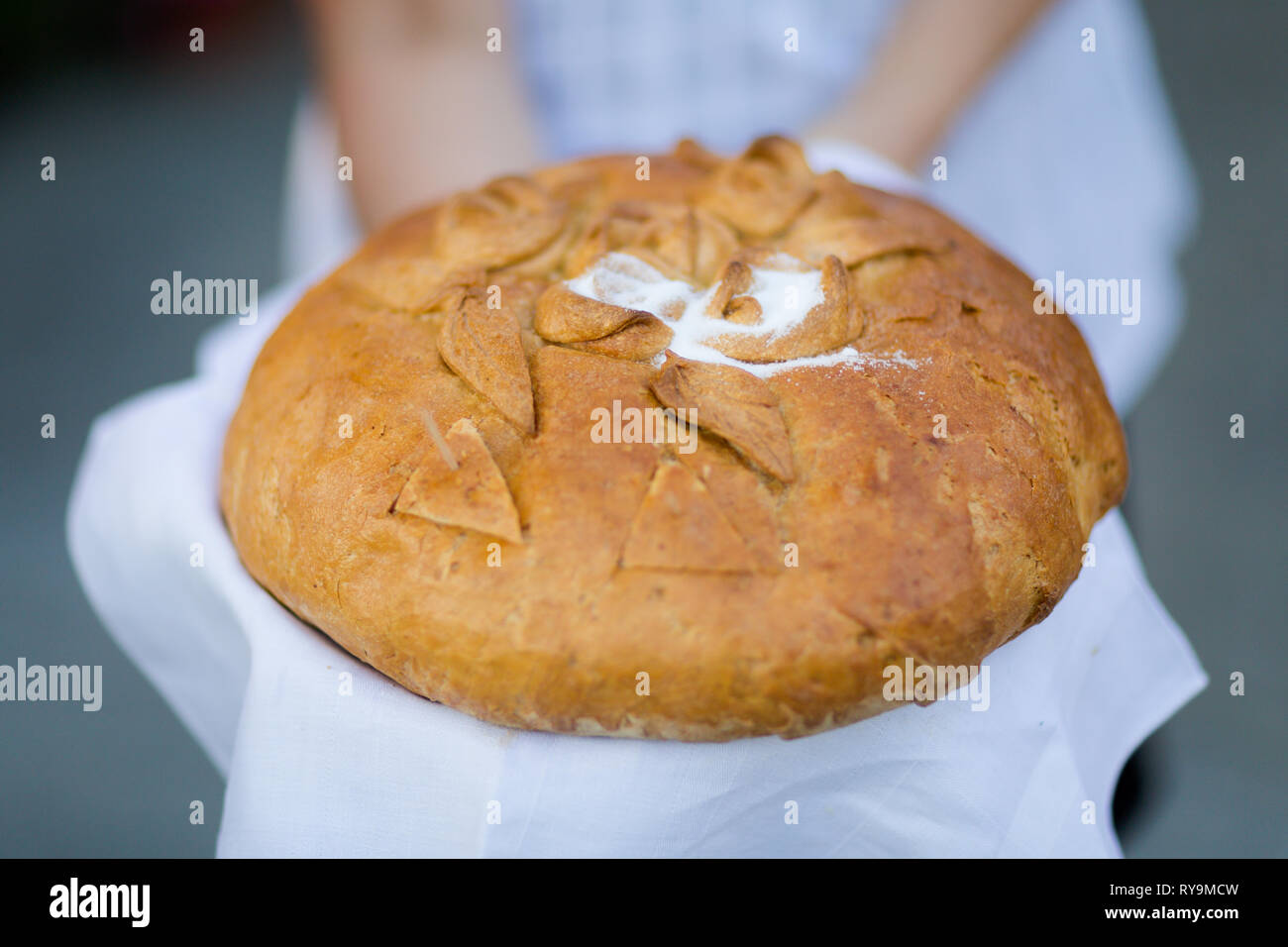 Wedding bread with salt detail on hands- traditional polish inviting to ...