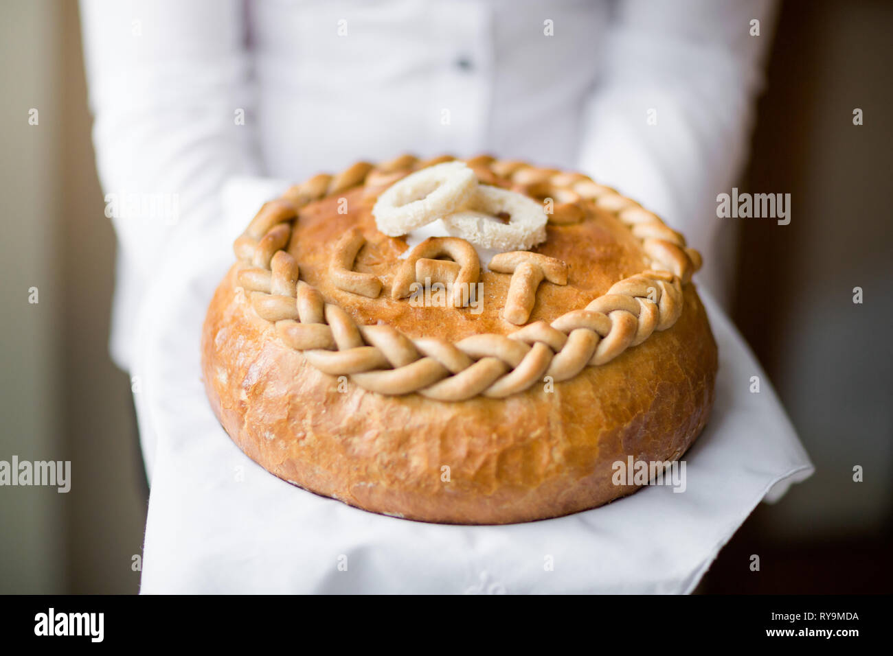 Wedding bread with salt detail on hands- traditional polish inviting to ...