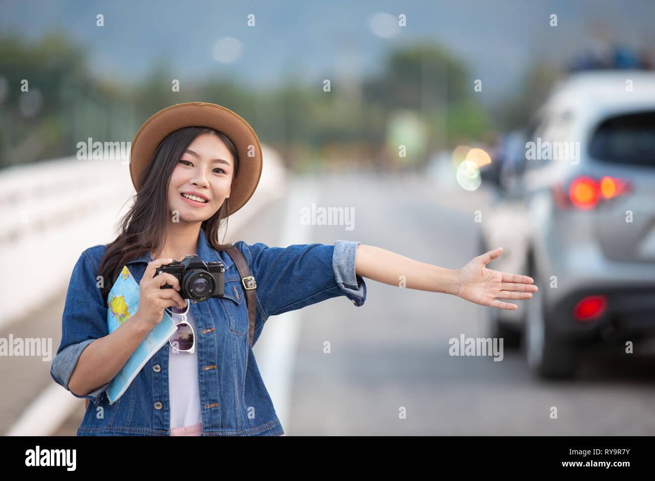 Female driver waving hand hi-res stock photography and images - Alamy