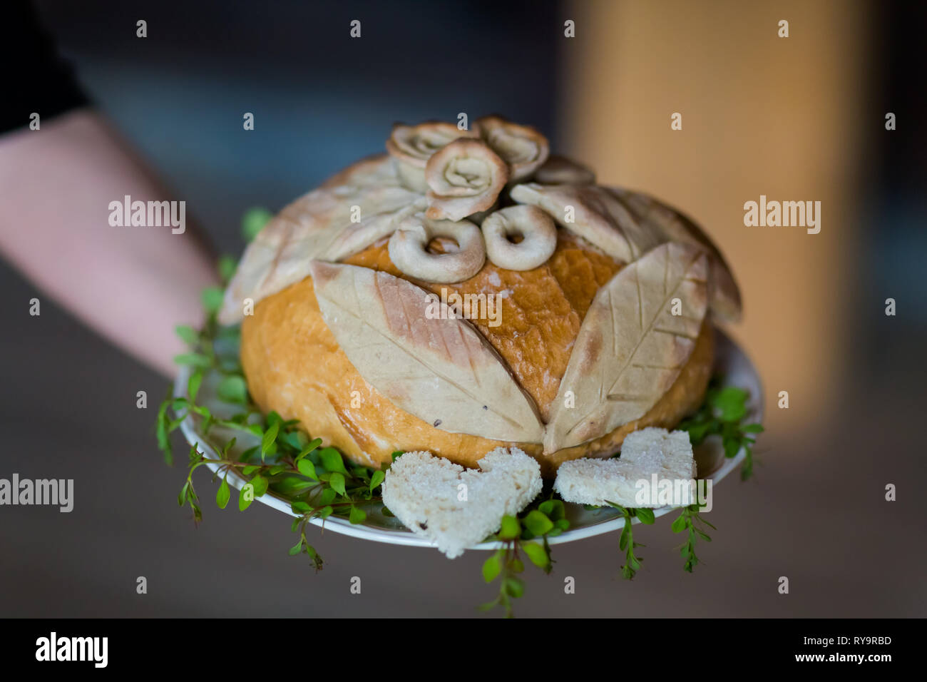 Wedding bread with salt detail on hands- traditional polish inviting to ...