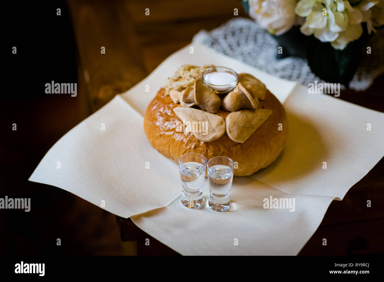 Wedding bread with salt detail on hands- traditional polish inviting to ...
