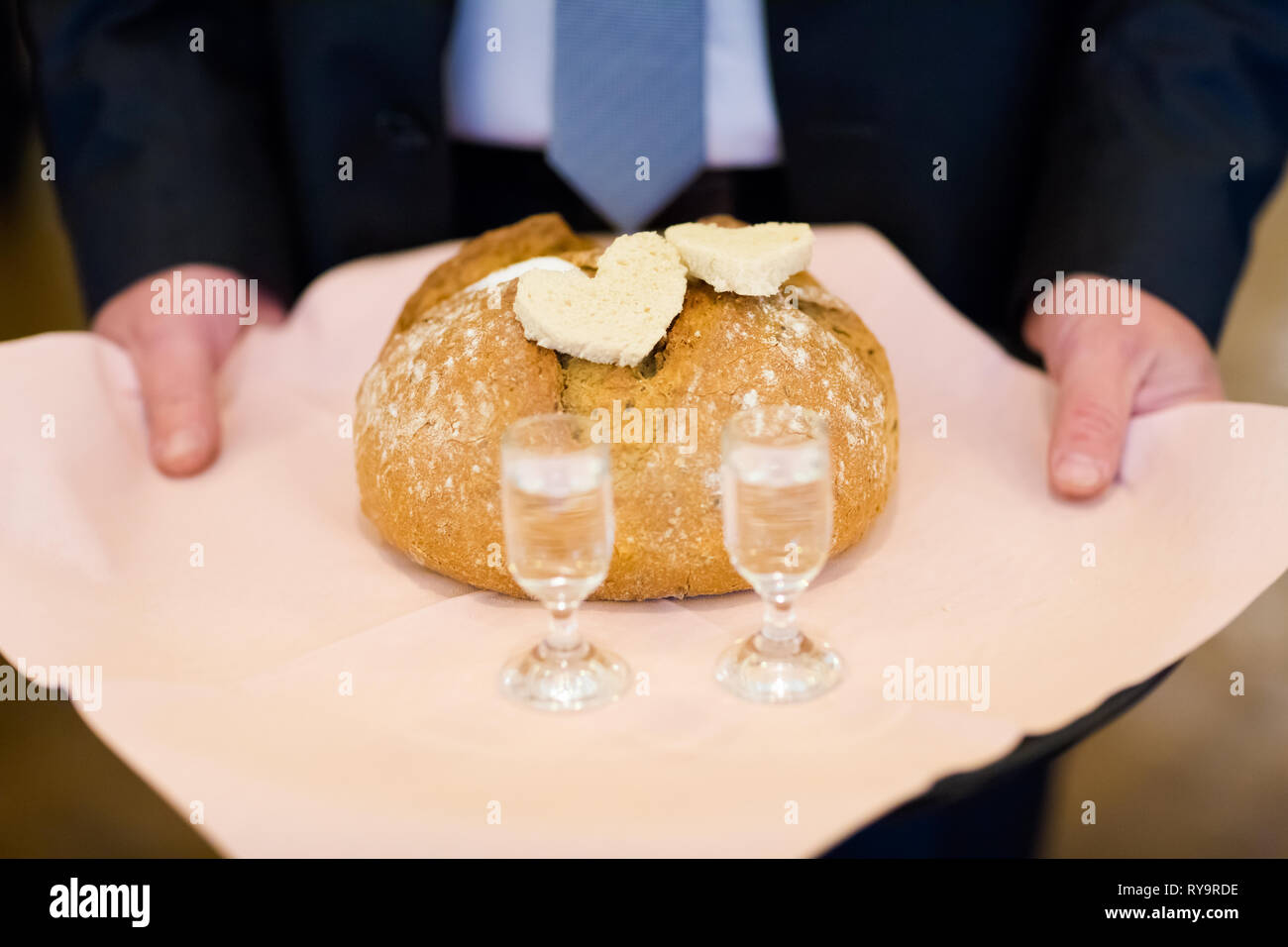 Wedding bread with salt detail on hands- traditional polish inviting to ...