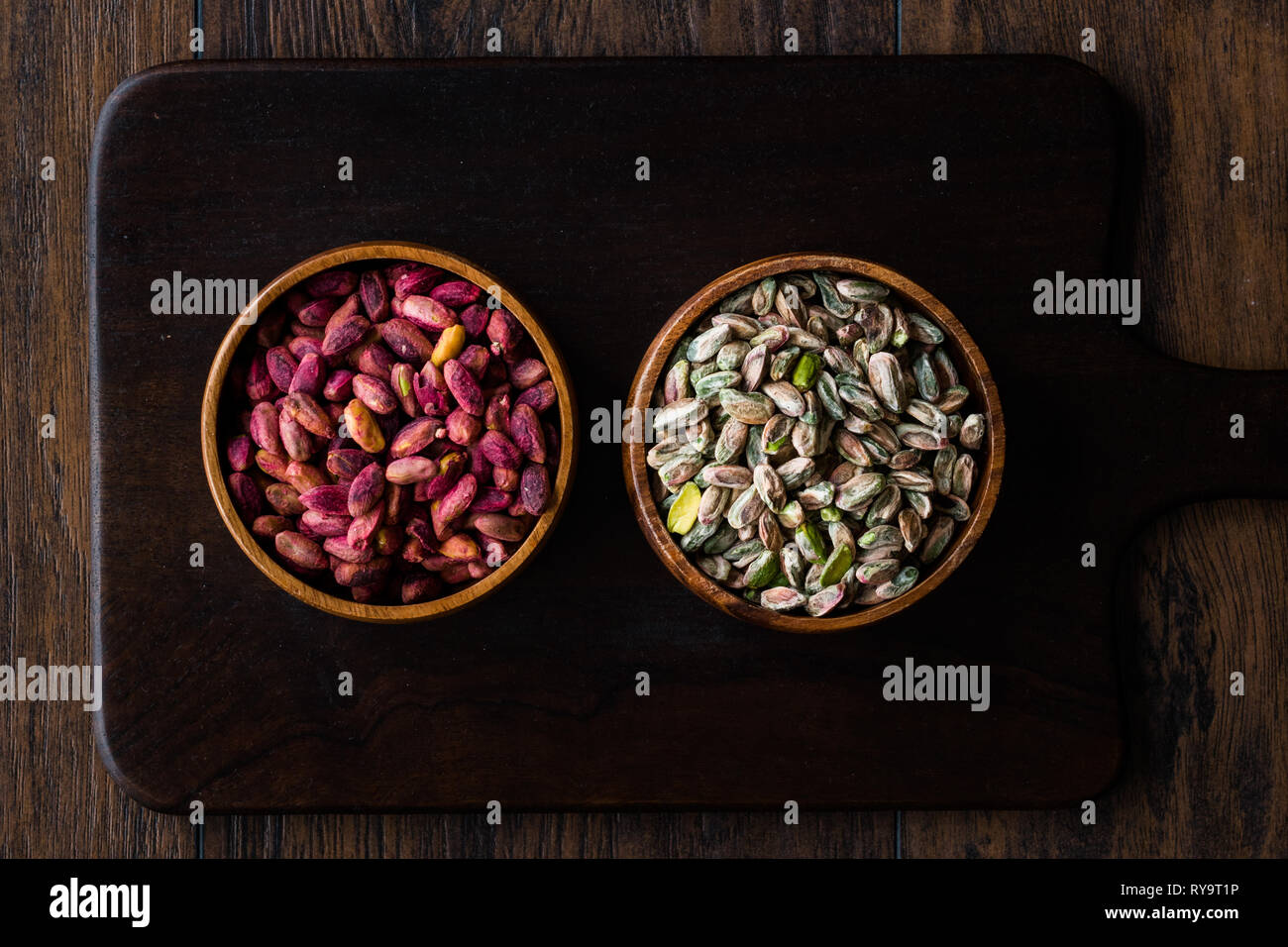 Raw and Roasted Wooden Bowl of Peeled Pistachios without Shell / with ...