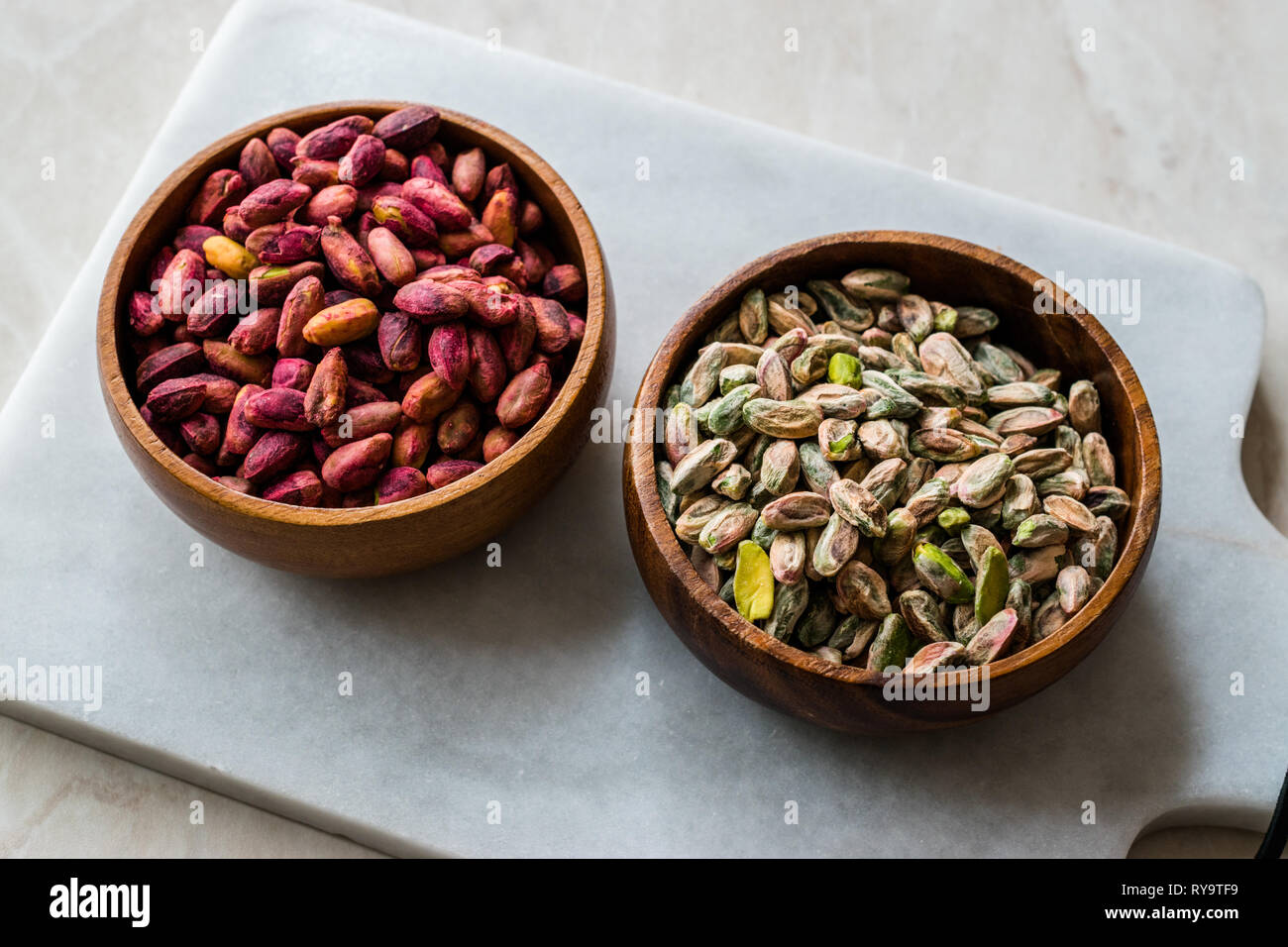 Raw and Roasted Wooden Bowl of Peeled Pistachios without Shell / with ...