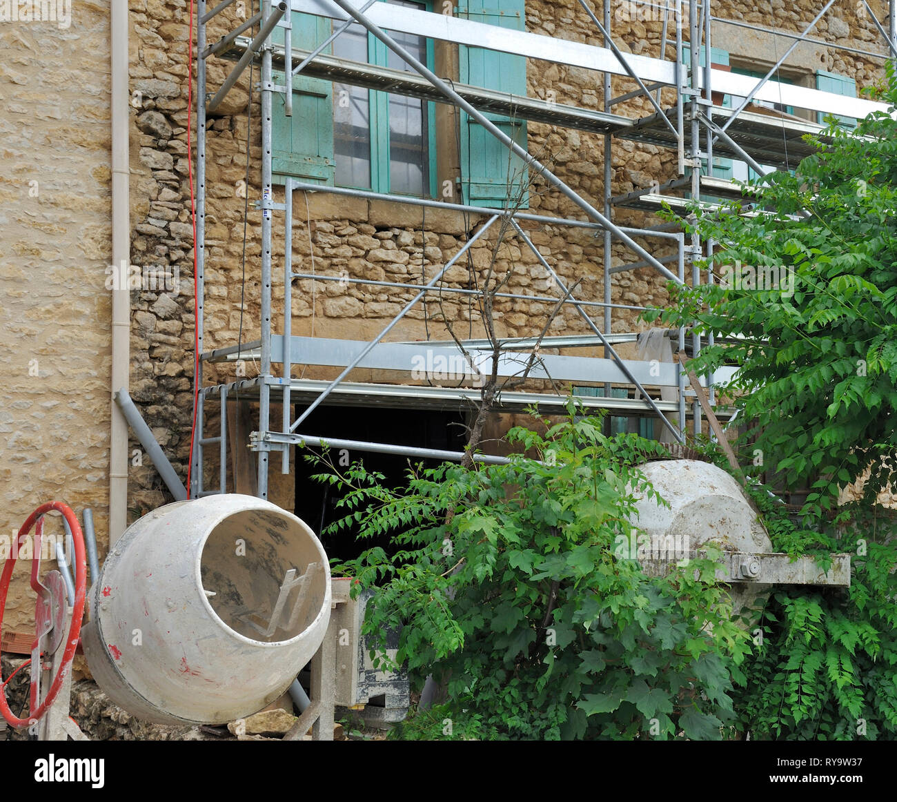 Building Your Own House In France On The Photo You See A Scarfold And Two Concrete mixers Stock building-your-own-house-in-france-on-the-photo-you-see-a-scarfold-and-two-concrete-mixers-stock