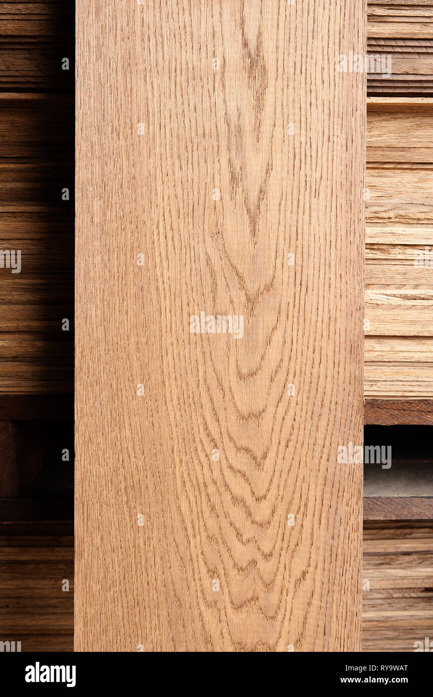 Lumber leaning on pile Stock Photo - Alamy