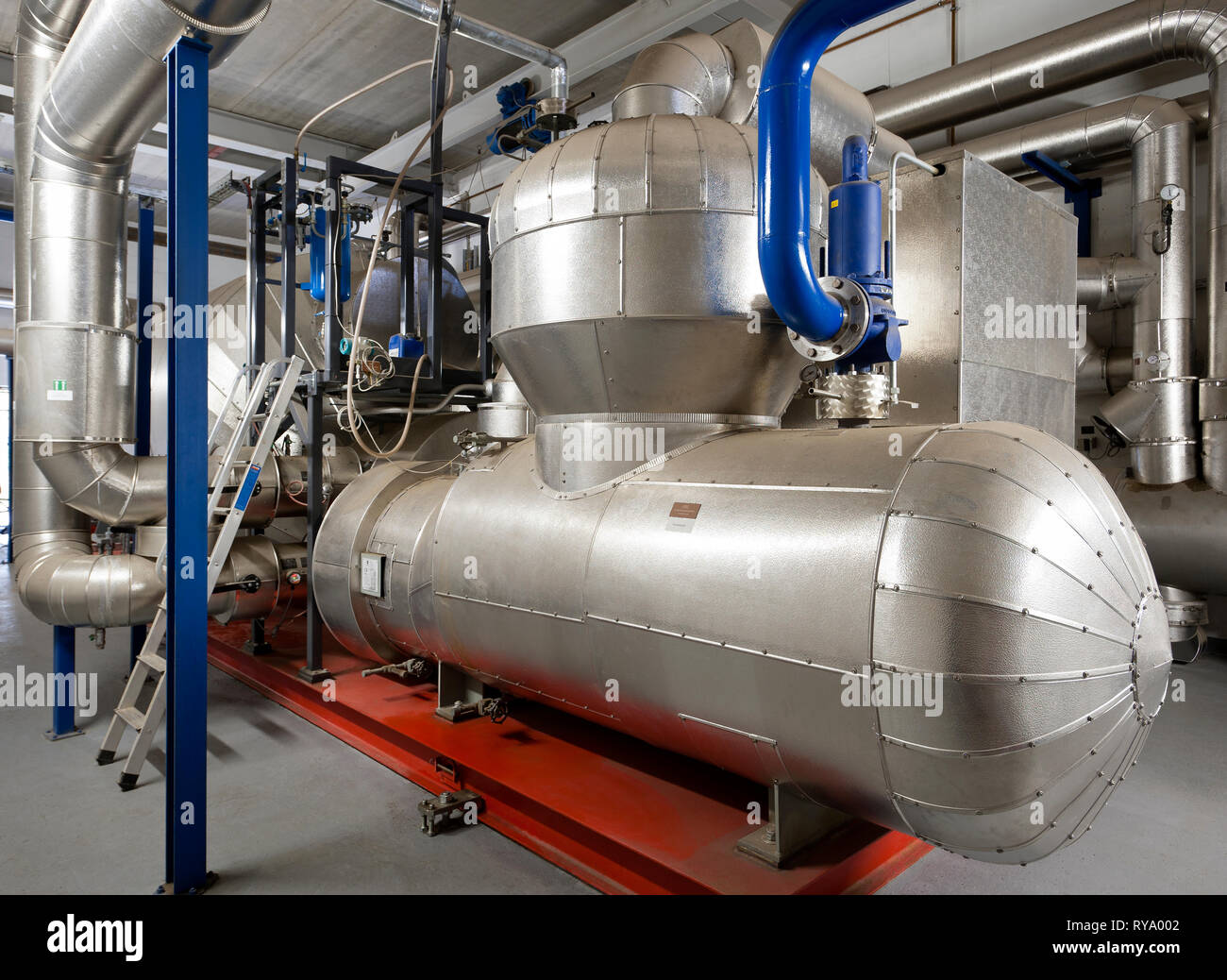 Silver machinery in factory Stock Photo - Alamy