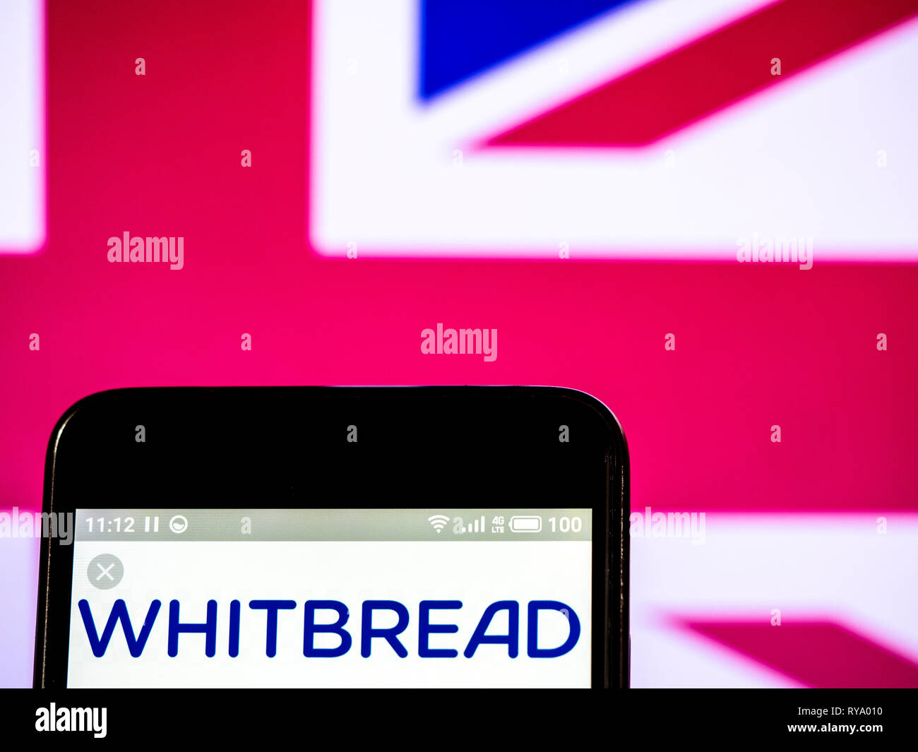 Whitbread plc company logo seen displayed on smart phone Stock Photo ...