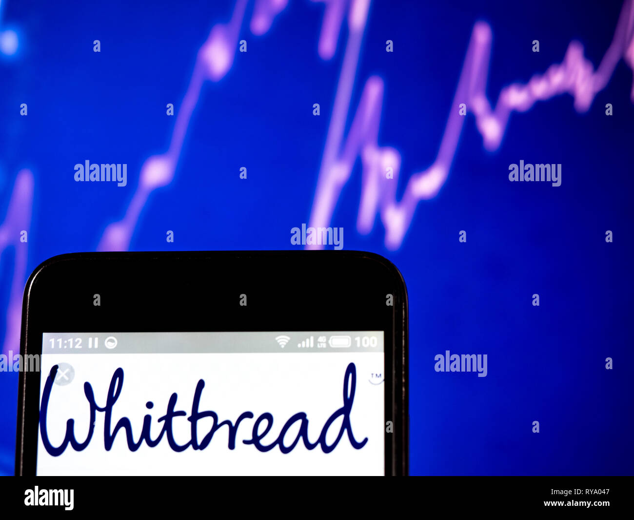 Whitbread plc company logo seen displayed on smart phone Stock Photo ...