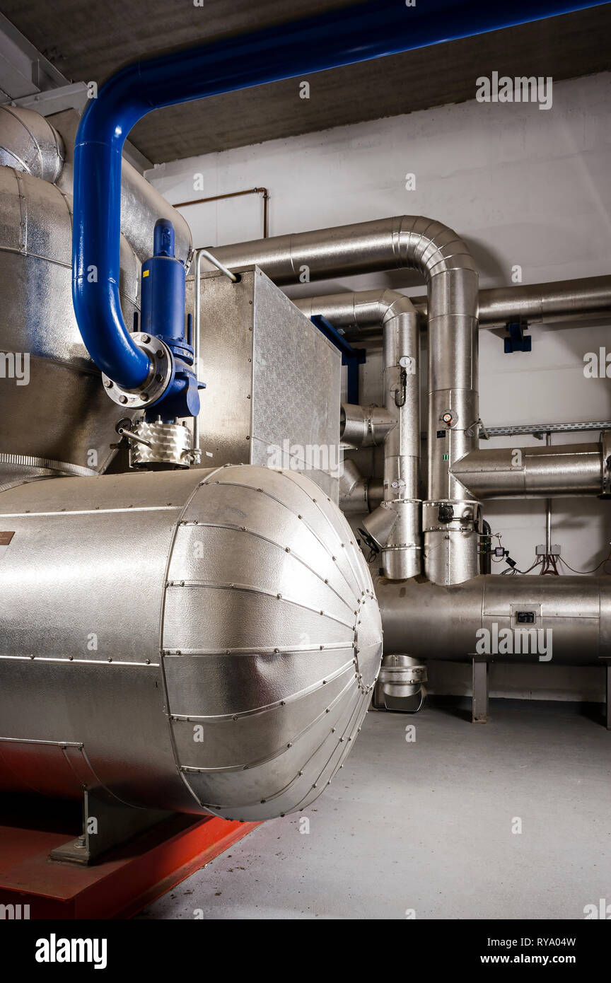 Silver machinery in factory Stock Photo - Alamy