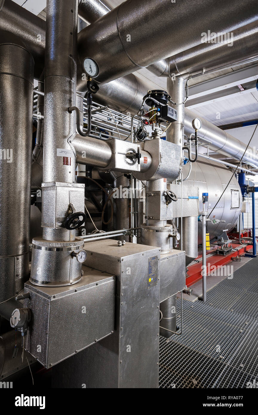 Silver machinery in factory Stock Photo - Alamy