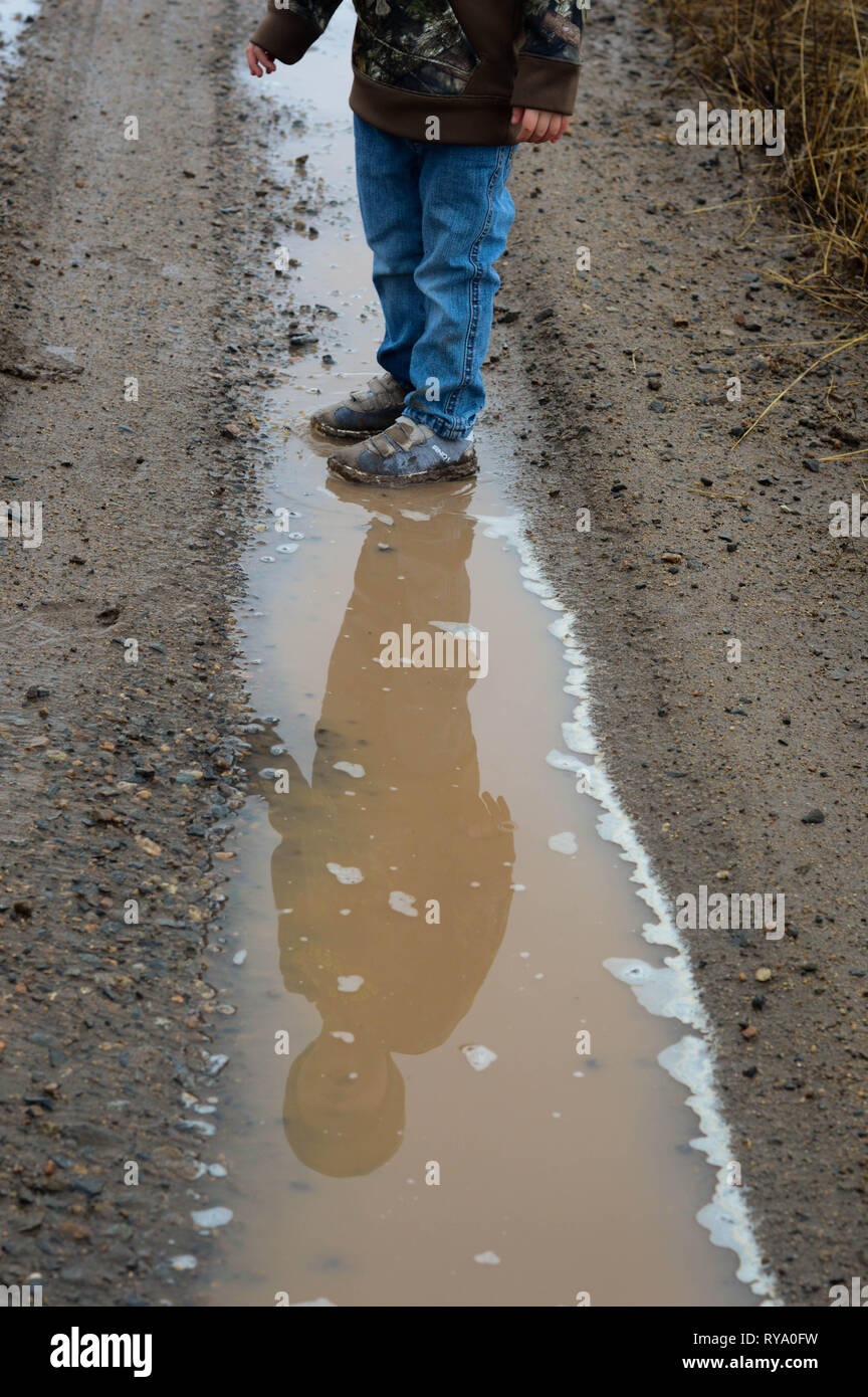 Boys jumping puddle hi-res stock photography and images - Alamy