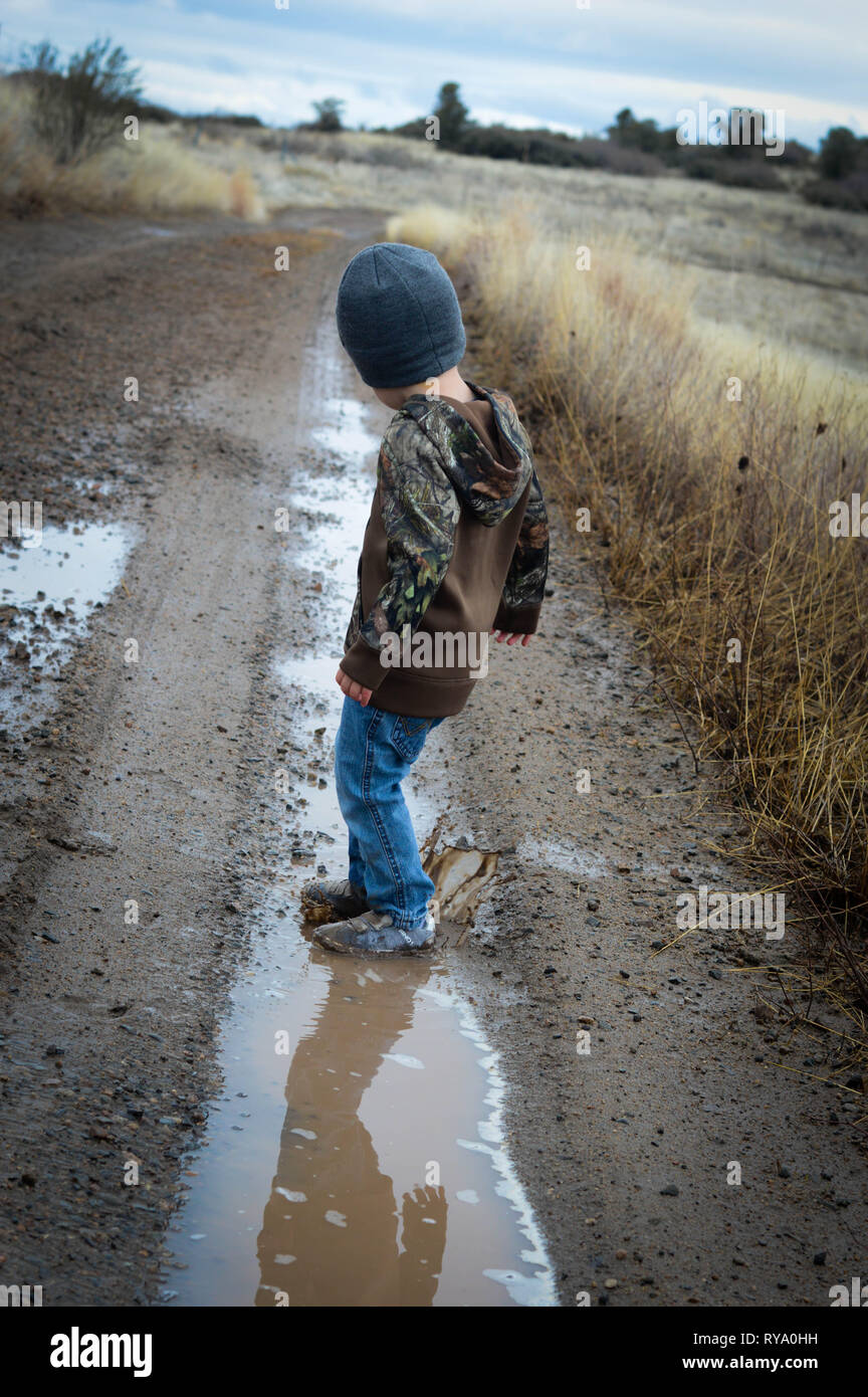Kids jumping puddle hi-res stock photography and images - Alamy