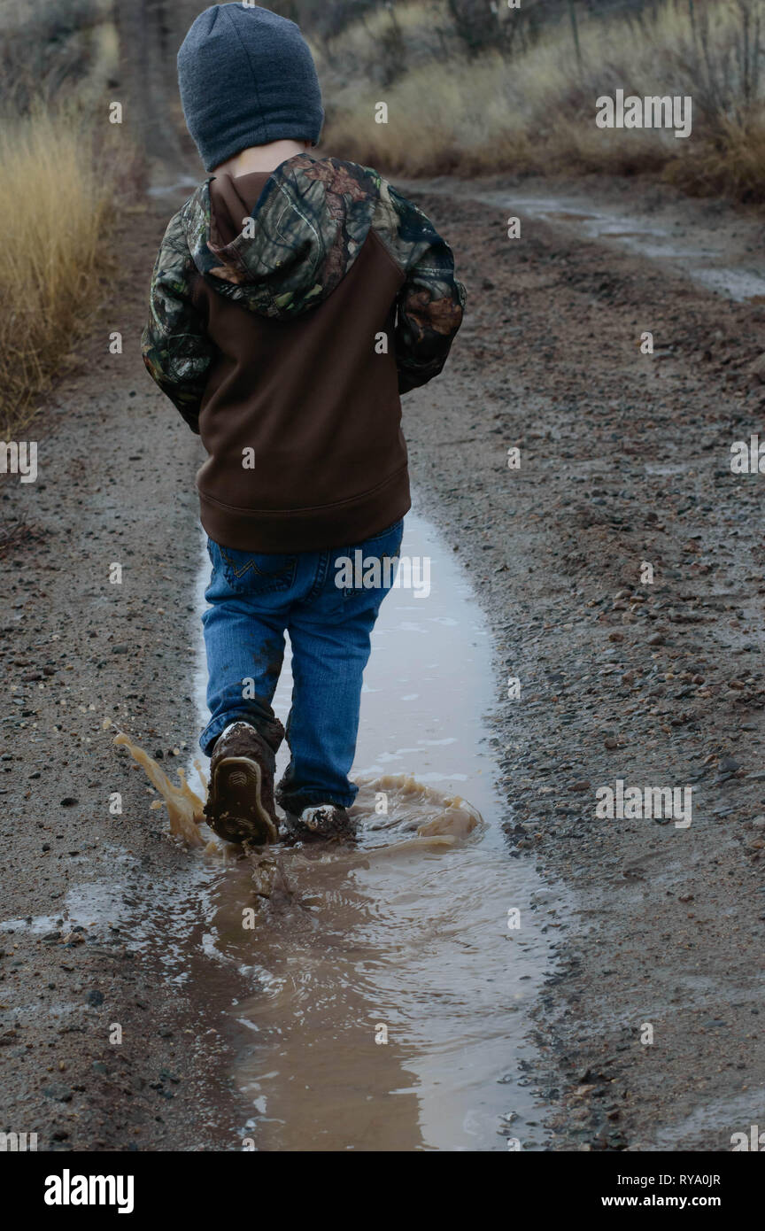 Kids jump puddle hi-res stock photography and images - Alamy