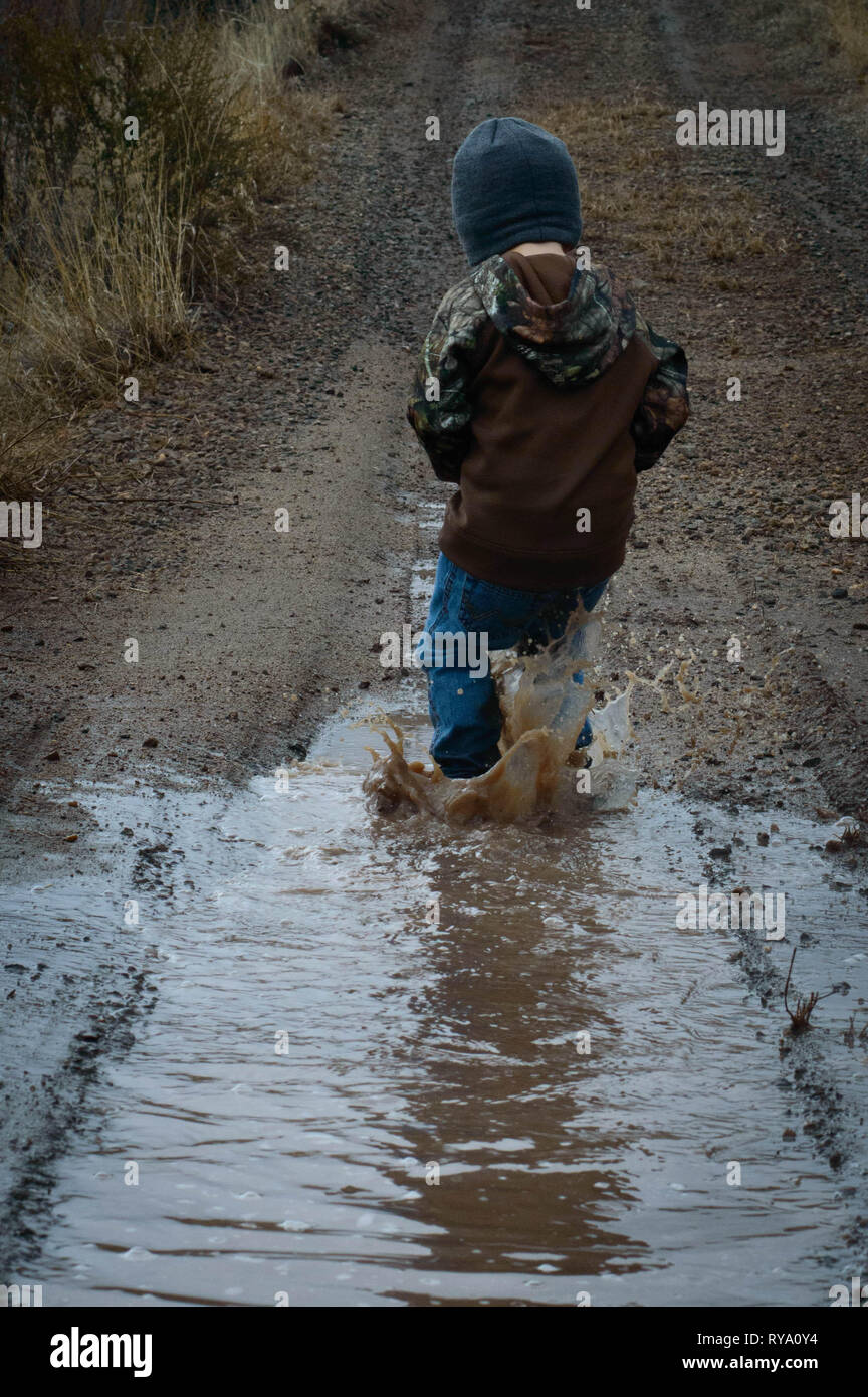 Kids puddle jump hi-res stock photography and images - Alamy