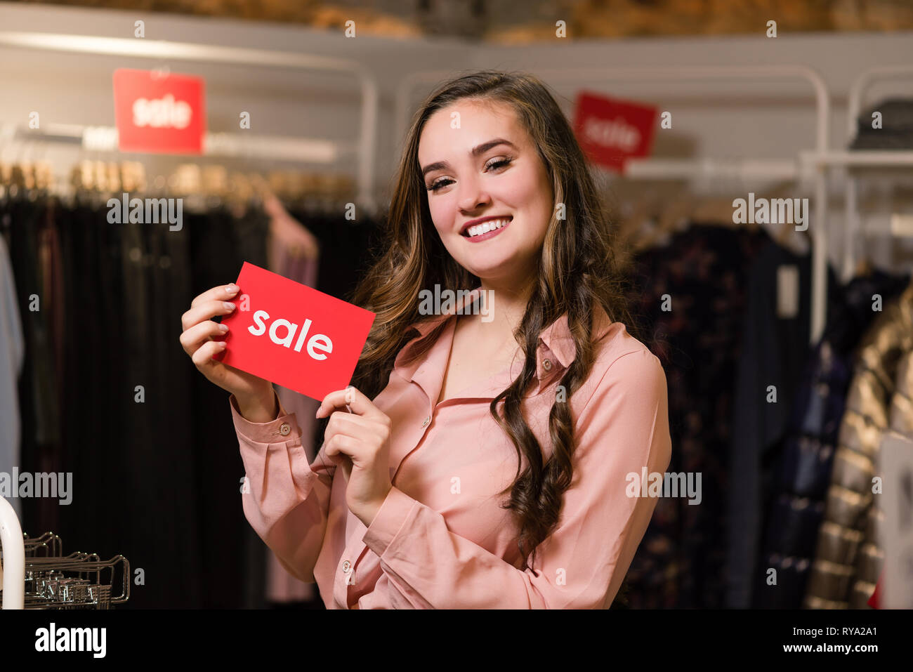 Happy woman holds sign hi-res stock photography and images - Alamy