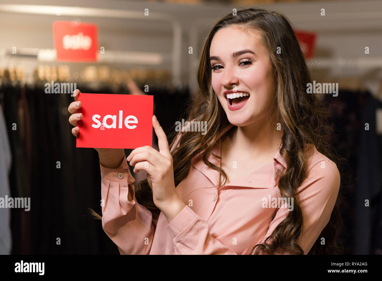 Woman holds red signs hi-res stock photography and images - Alamy