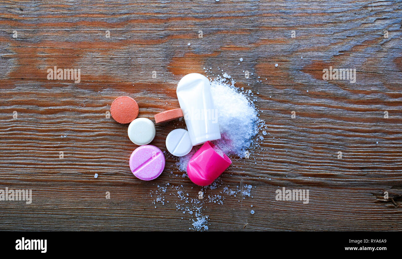 open capsule on wood background,image Stock Photo - Alamy