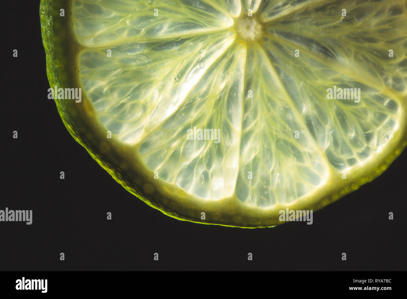 Closeup photo of a thin sliced lime Stock Photo - Alamy