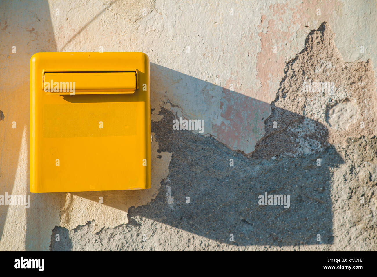 yellow post box on old wall. copy space. letter delivery Stock Photo ...