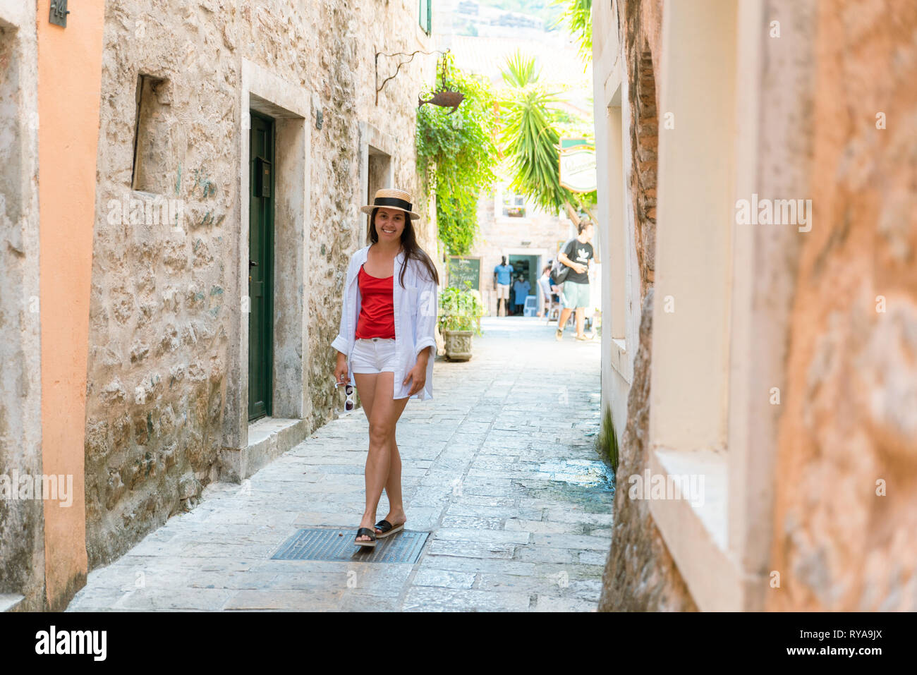 young pretty woman walking by city street Stock Photo - Alamy