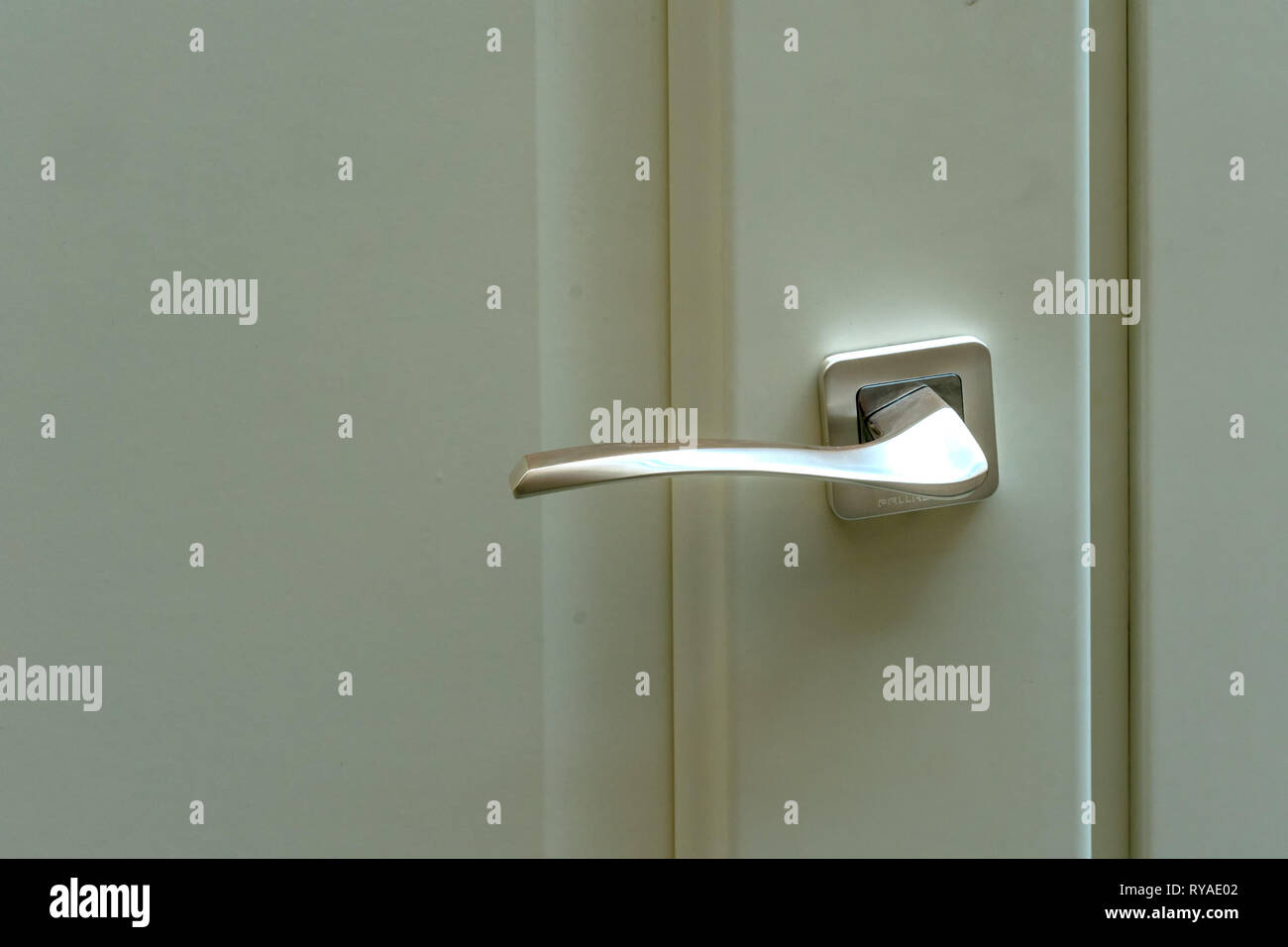 Closeup of metal doorhandle Stock Photo - Alamy