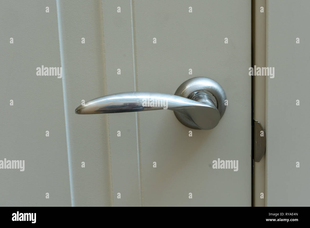 Closeup of metal doorhandle Stock Photo - Alamy