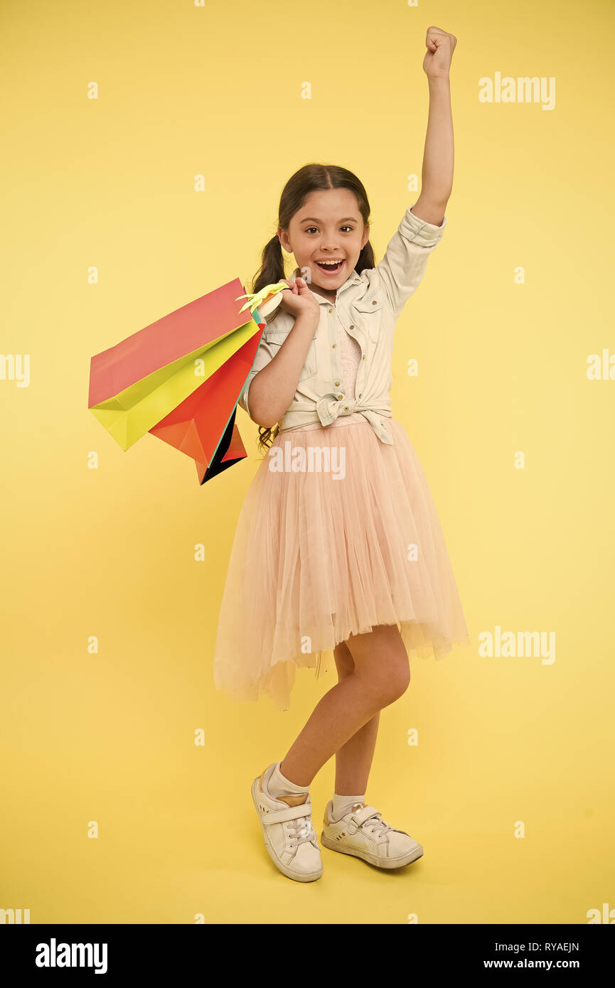 Bought new dress. Girl shopaholic likes shopping on sale season. Child ...