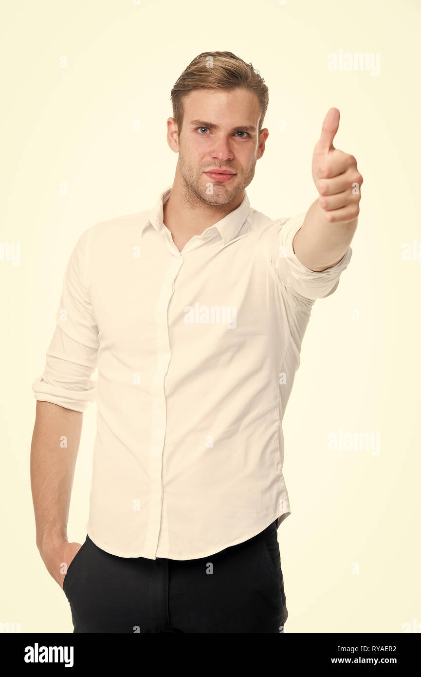 Excellent quality. Guy shows thumb up. Man calm face posing confidently ...