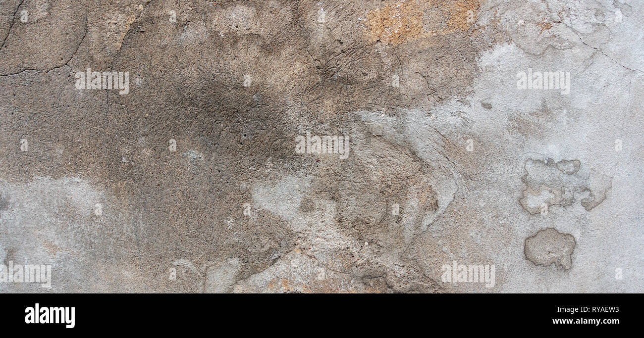 Dark plaster wall with dirty cracked scratched background. Old retro ...