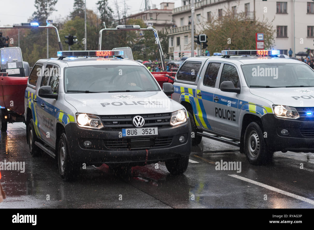 European street, Prague-October 28, 2018: Police workers riding cars ...