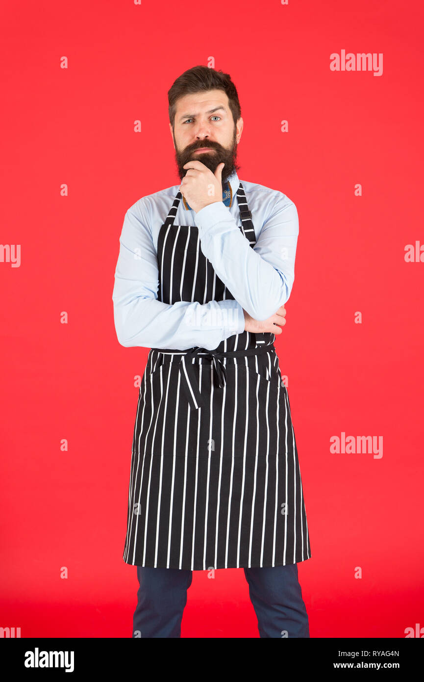 On duty in kitchen. Man with beard cook hipster apron. Hipster chef ...