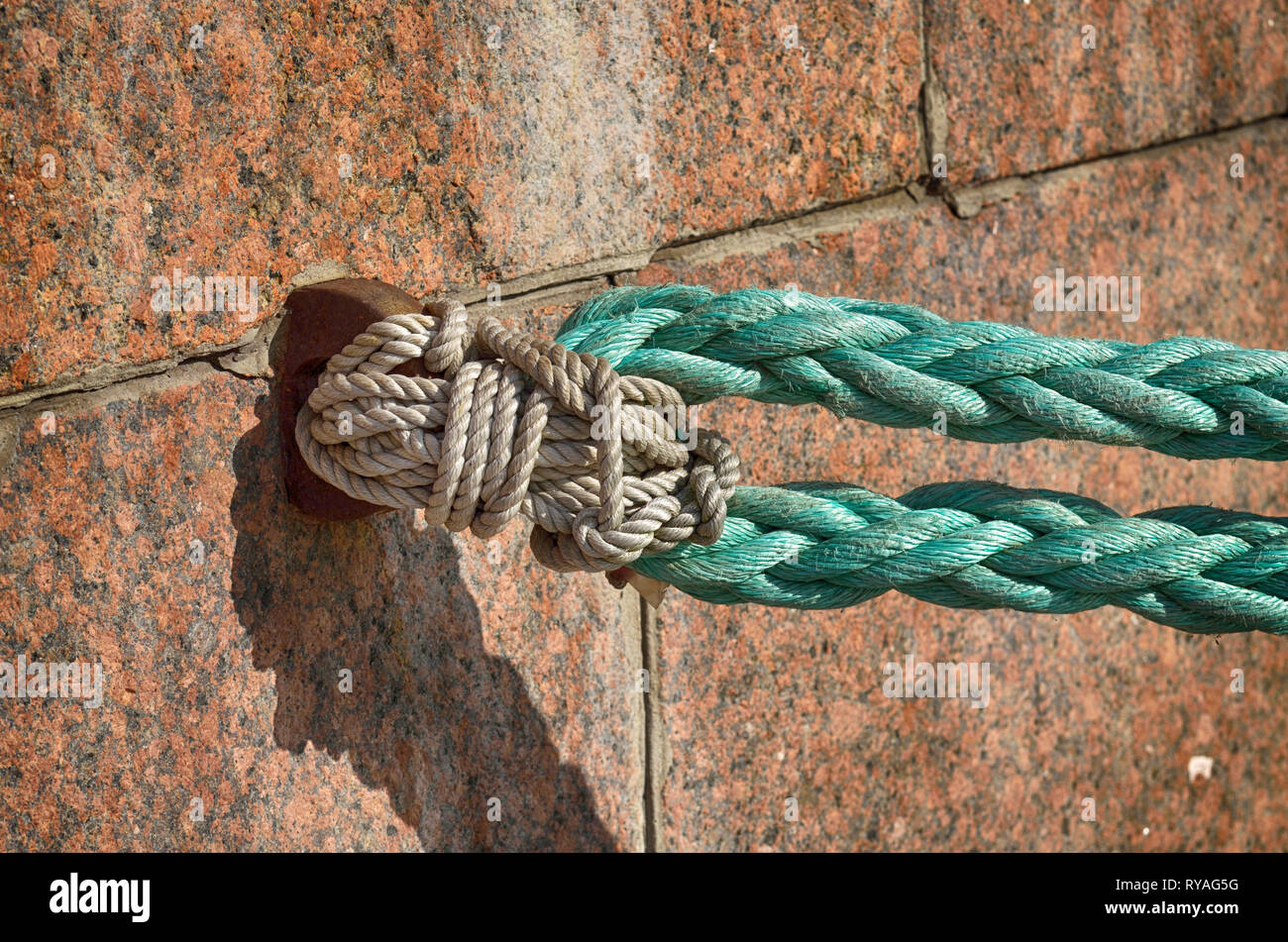 Tied a strong knot.The ship is attached by rope to the waterfront Stock ...