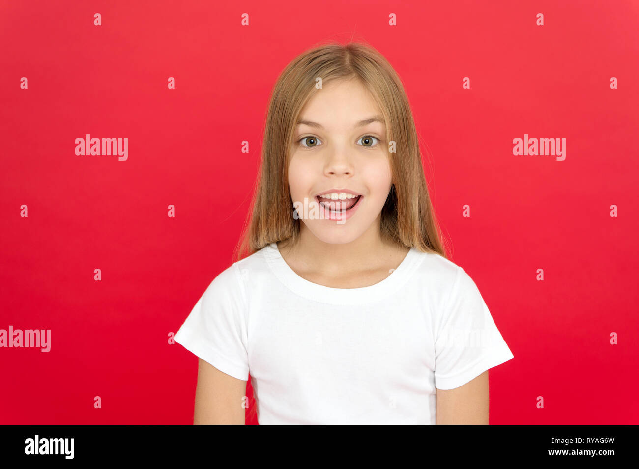 What a happy surprise. Surprised little girl. Adorable little child ...