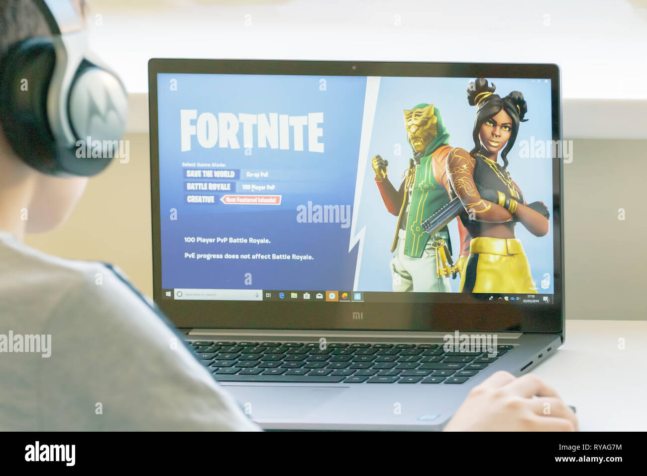 Boy playing Fortnite game. Fortnite is popular online video game ...
